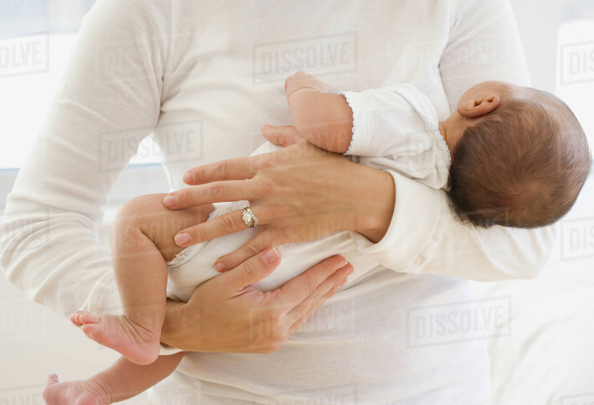 Close up of mother holding newborn baby - Royalty-free Stock Photo ...