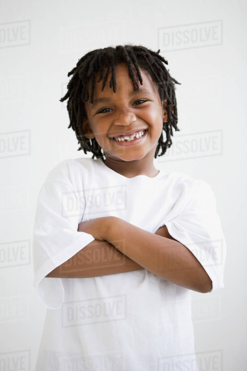 African boy with arms crossed - Stock Photo - Dissolve