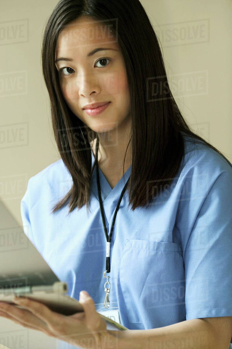 Female doctor with medical chart - Royalty-free Stock Photo | Dissolve