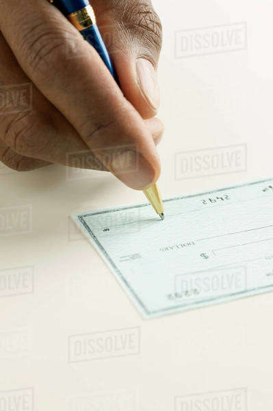 Close up of hand writing check - Royalty-free Stock Photo | Dissolve
