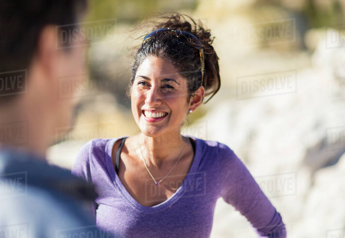 Woman smiling outdoors - Royalty-free Stock Photo | Dissolve