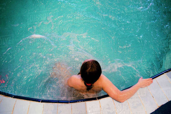 Caucasian woman sitting in swimming pool - Royalty-free Stock Photo ...