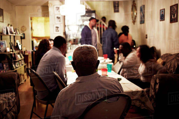 Family eating dinner at table - Stock Photo - Dissolve