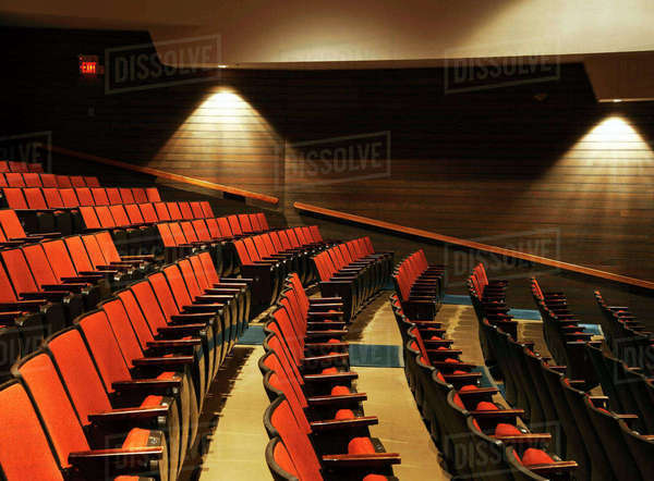 Empty chairs in movie theater - Royalty-free Stock Photo | Dissolve