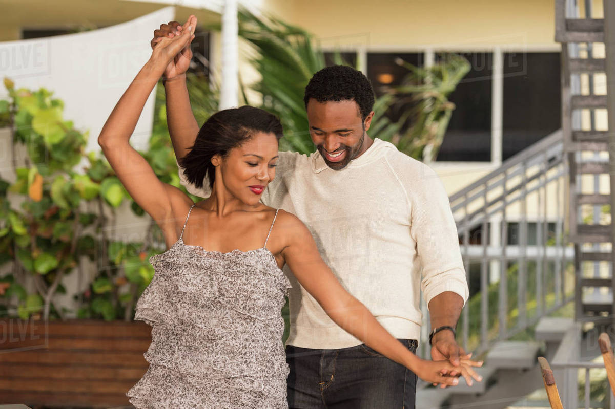 Couple dancing outdoors - Royalty-free Stock Photo | Dissolve