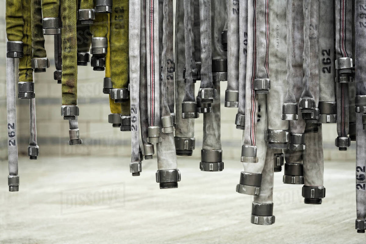 Detail of hanging fire hoses - Royalty-free Stock Photo | Dissolve
