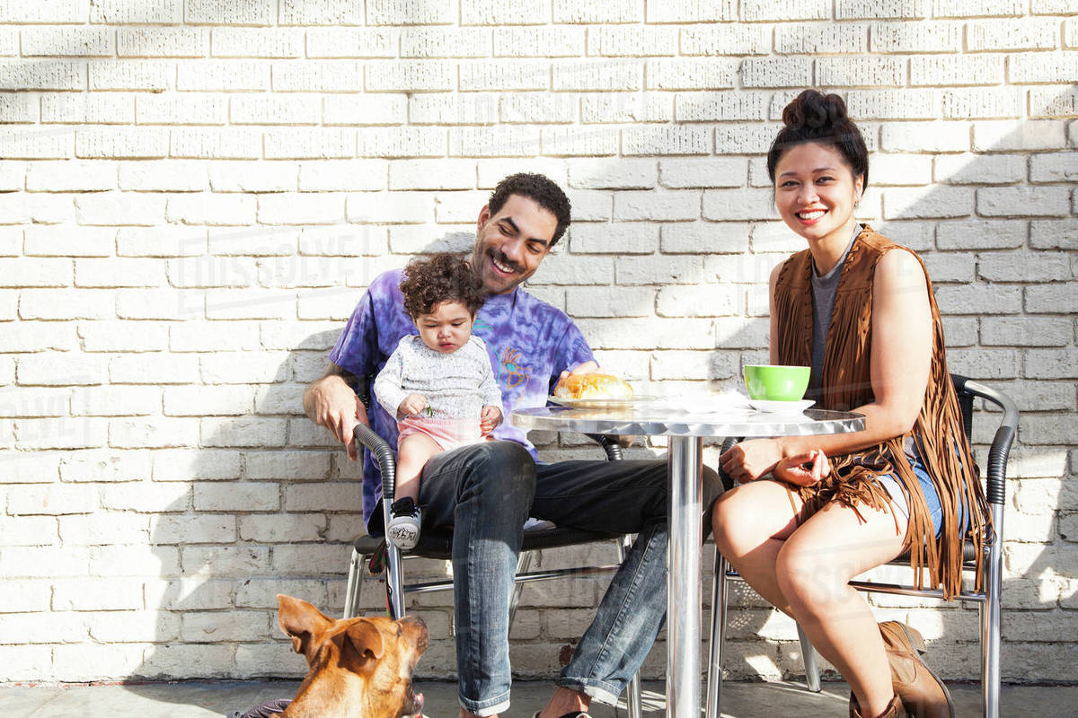 Parents eating with baby son at outdoor cafe - Royalty-free Stock Photo ...