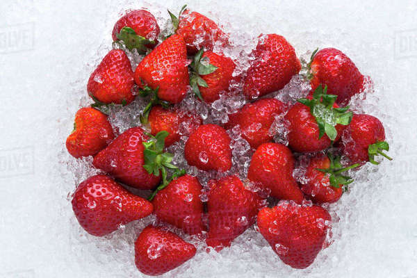 Strawberries on ice - Royalty-free Stock Photo | Dissolve