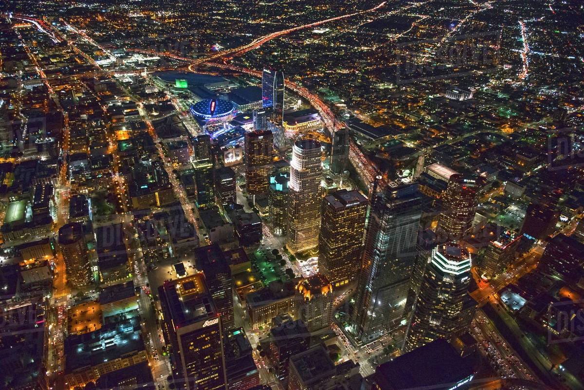 Aerial view of Los Angeles cityscape lit up at night, California ...