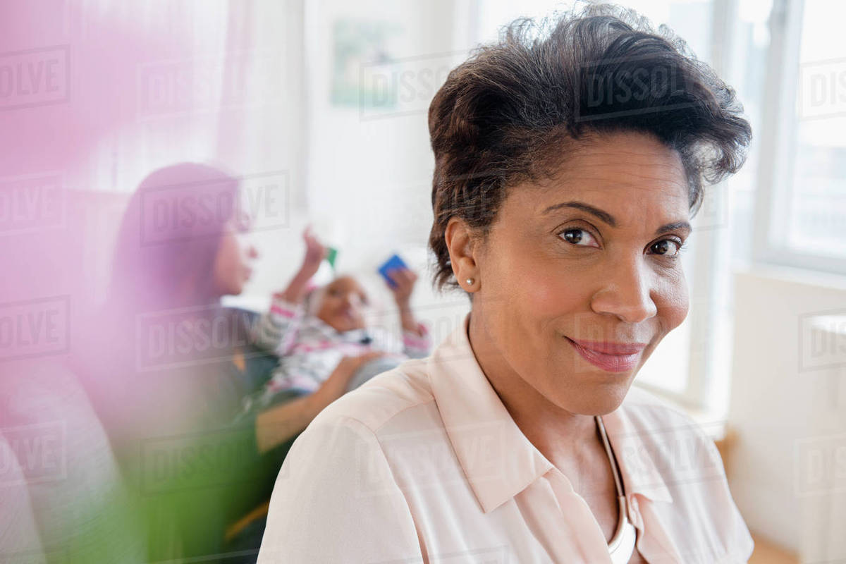 Older Black woman smiling - Stock Photo - Dissolve