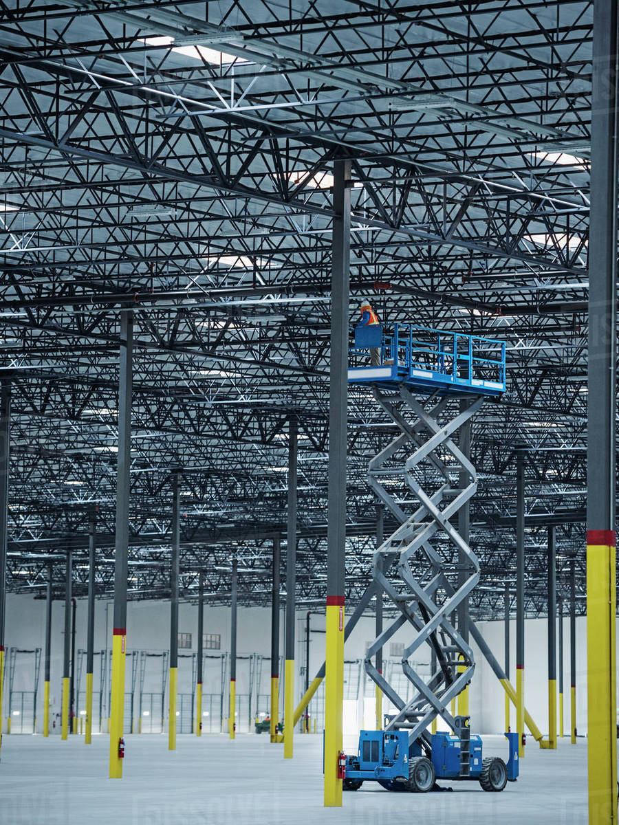 Indian worker on warehouse lift platform - Royalty-free Stock Photo ...