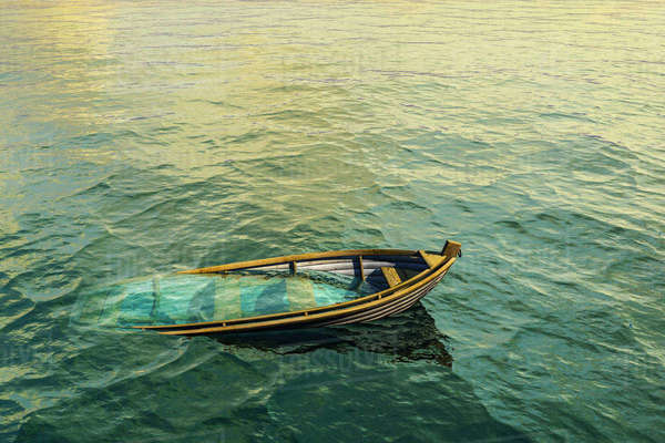 Abandoned sinking rowboat in ocean - Stock Photo - Dissolve