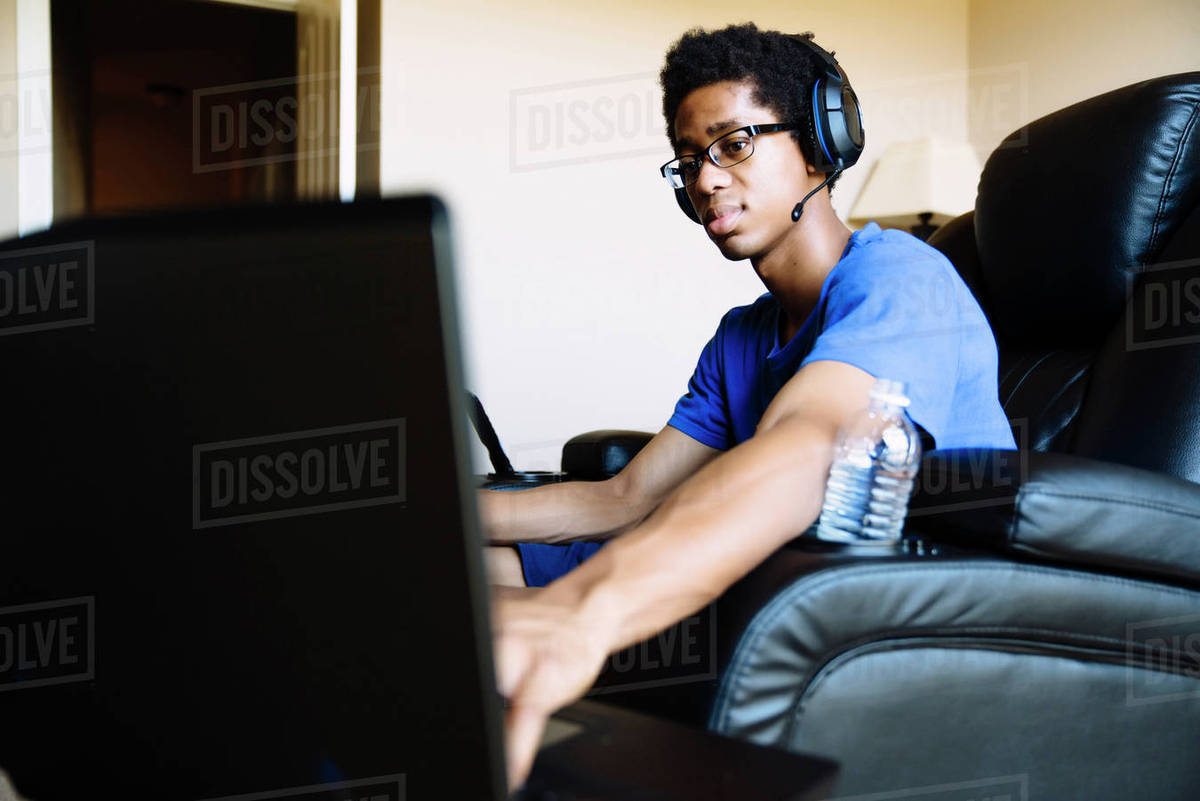 Black man playing video game - Royalty-free Stock Photo | Dissolve