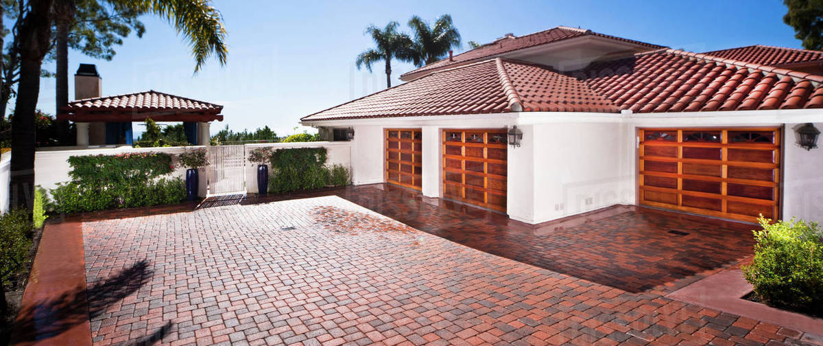 Exterior shot of closed garages with brick flooring - Royalty-free ...
