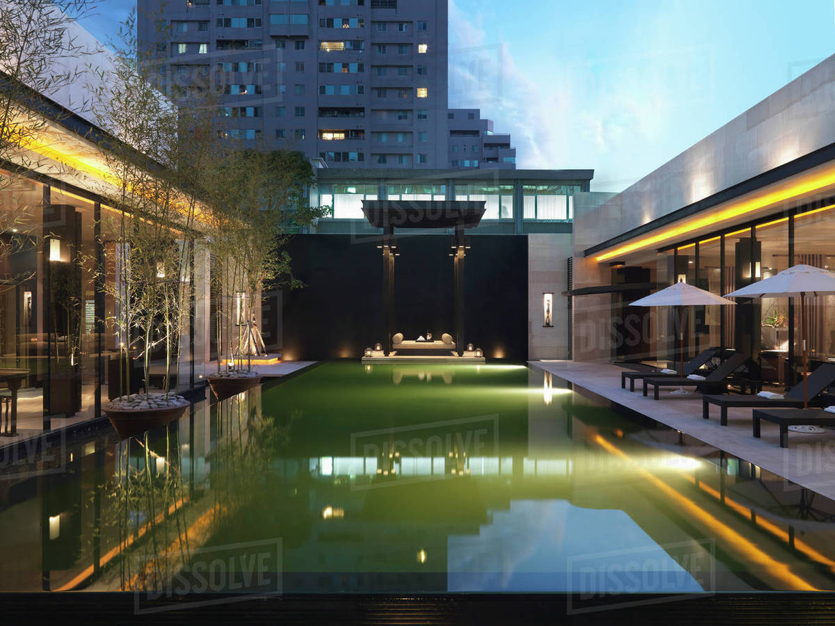 Modern swimming pool at dusk - Royalty-free Stock Photo | Dissolve