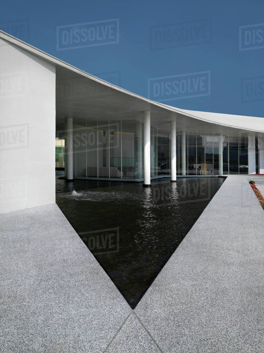 Triangular shaped pool outside modern building - Royalty-free Stock ...