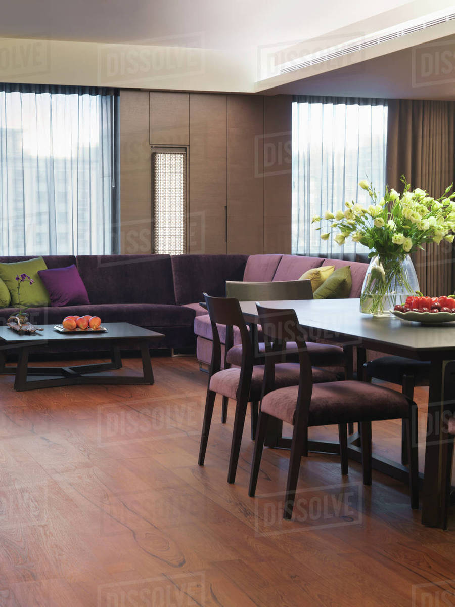 Dining room table sofa in modern home - Stock Photo - Dissolve