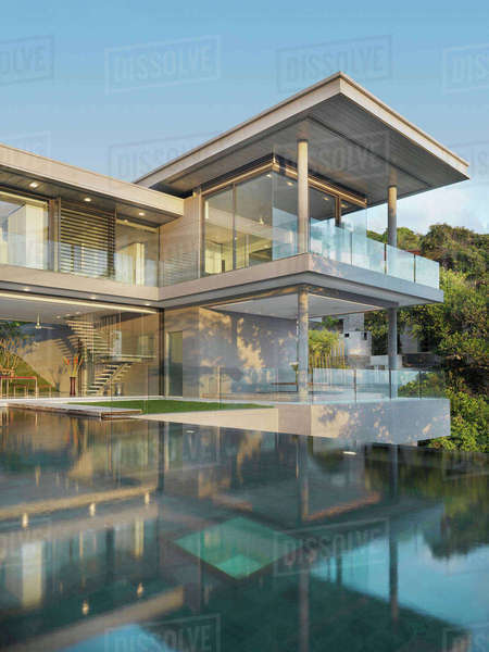 Multiple story modern home with swimming pool out front - Stock Photo ...