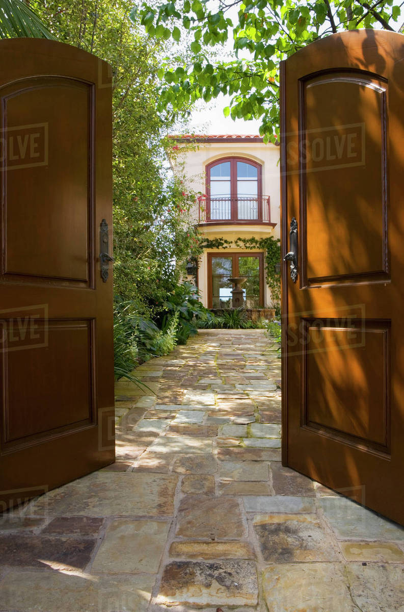 Front Gate Open to Home Courtyard - Stock Photo - Dissolve