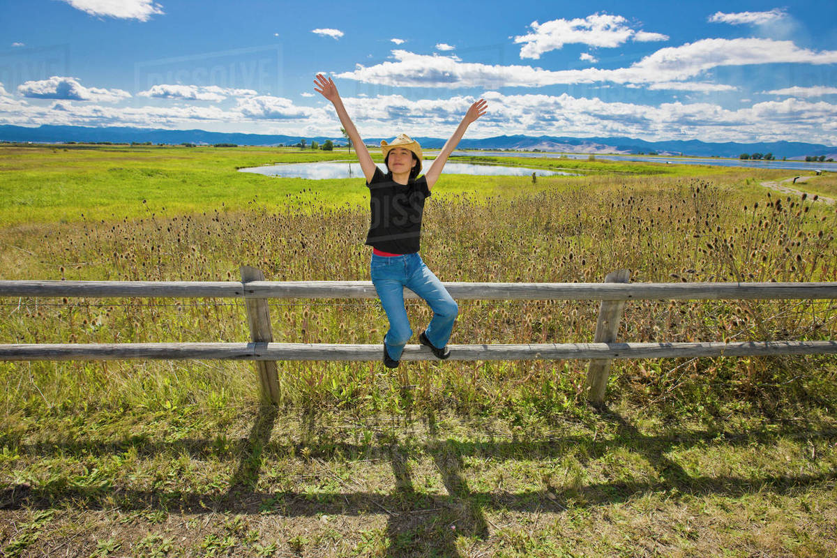 Japanese woman sitting on remote countryside field - Royalty-free Stock ...