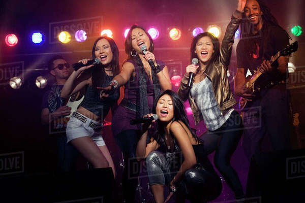 Musical group performing onstage - Stock Photo - Dissolve