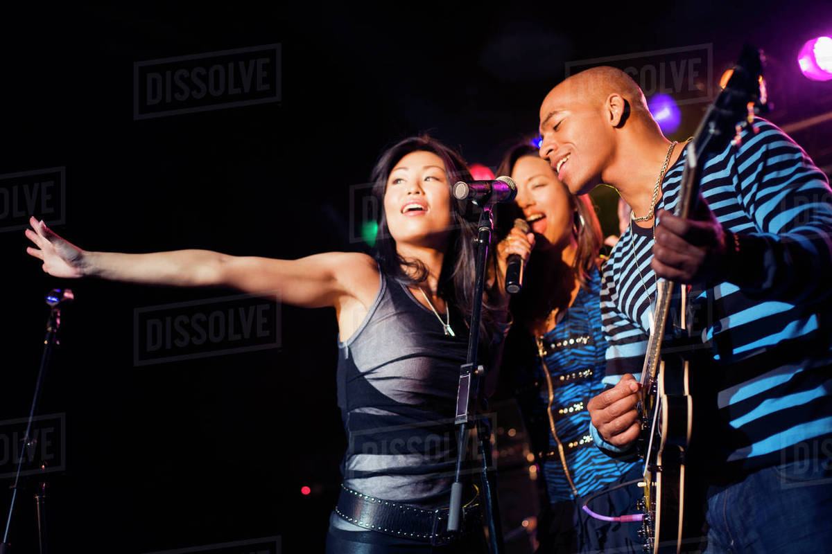 Musical group performing onstage - Royalty-free Stock Photo | Dissolve