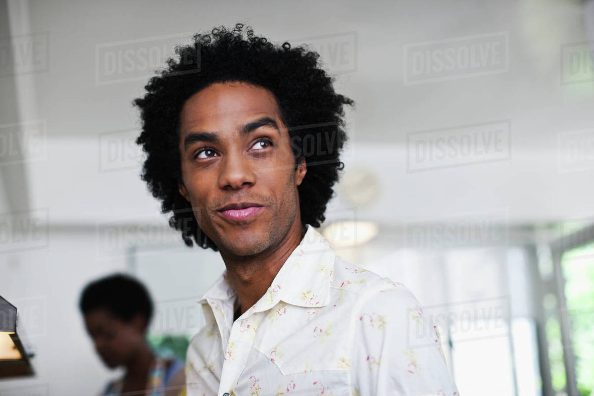 Mixed race man smiling - Royalty-free Stock Photo | Dissolve