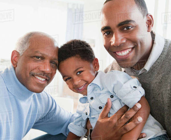African American grandfather smiling with son and grandson - Royalty ...
