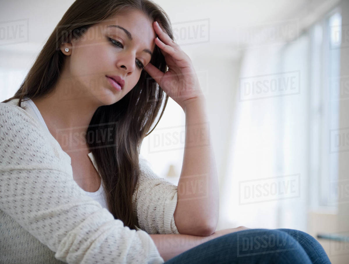 Disappointed Indian woman with head in hands - Royalty-free Stock Photo ...