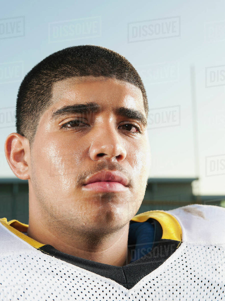 Serious Hispanic football player - Royalty-free Stock Photo | Dissolve