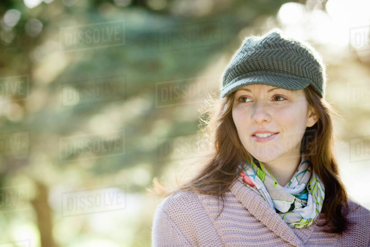 Caucasian woman in cap outdoors - Stock Photo - Dissolve