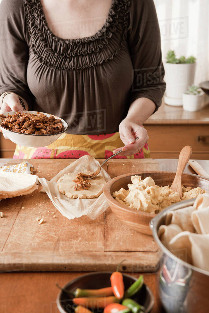 Woman making tamales - Royalty-free Stock Photo | Dissolve