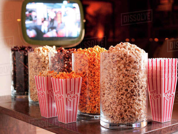 Various flavors of popcorn in containers - Royalty-free Stock Photo ...