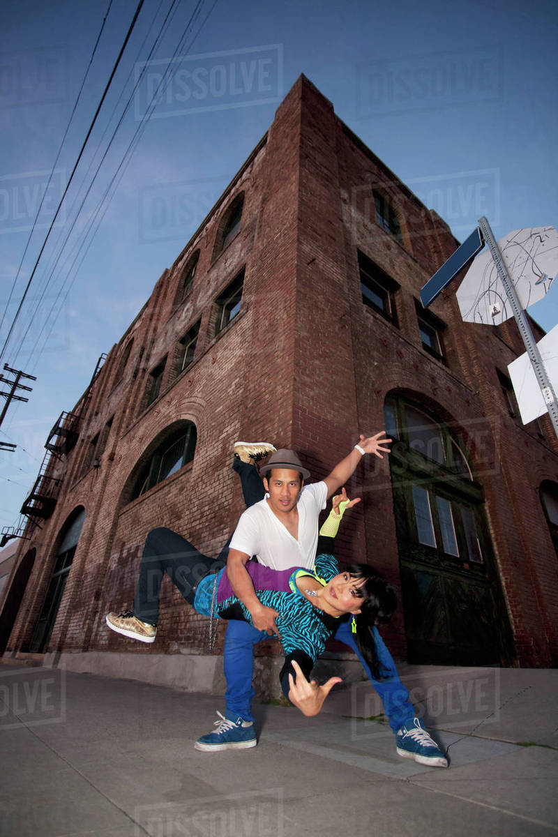 Couple breakdancing in urban area - Royalty-free Stock Photo | Dissolve