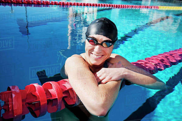 Competitive swimmer leaning on rope in swimming pool - Royalty-free ...