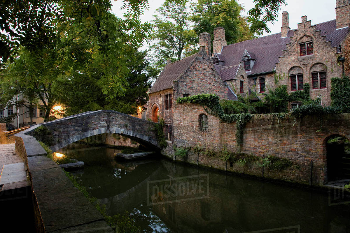 Quaint building and bridge over canal - Royalty-free Stock Photo | Dissolve