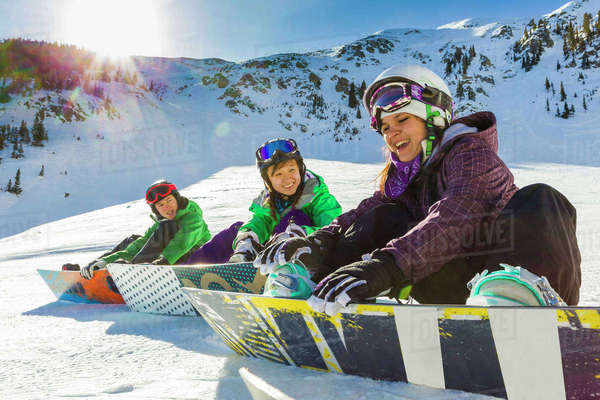 Teenagers snowboarding together - Royalty-free Stock Photo | Dissolve