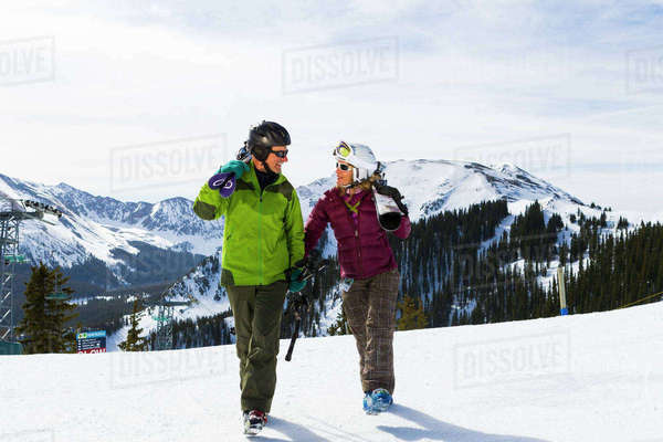 Caucasian couple skiing together - Royalty-free Stock Photo | Dissolve