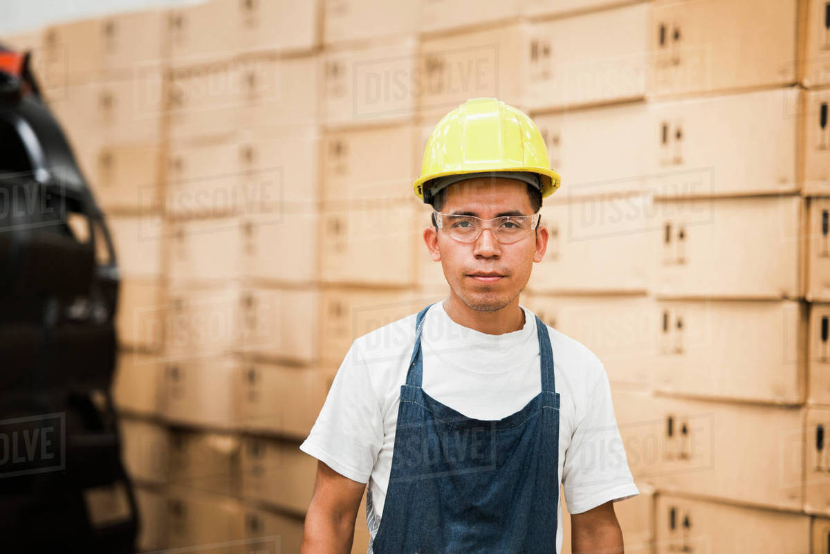 Worker standing in manufacturing plant - Royalty-free Stock Photo ...