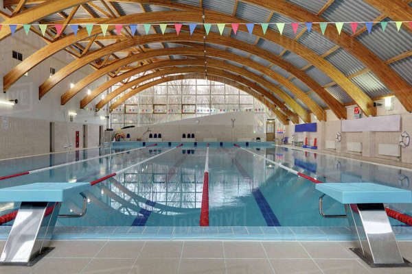 Wooden arches over swimming pool - Royalty-free Stock Photo | Dissolve