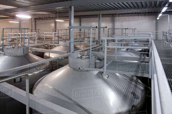 Stainless steel vats in factory - Royalty-free Stock Photo | Dissolve
