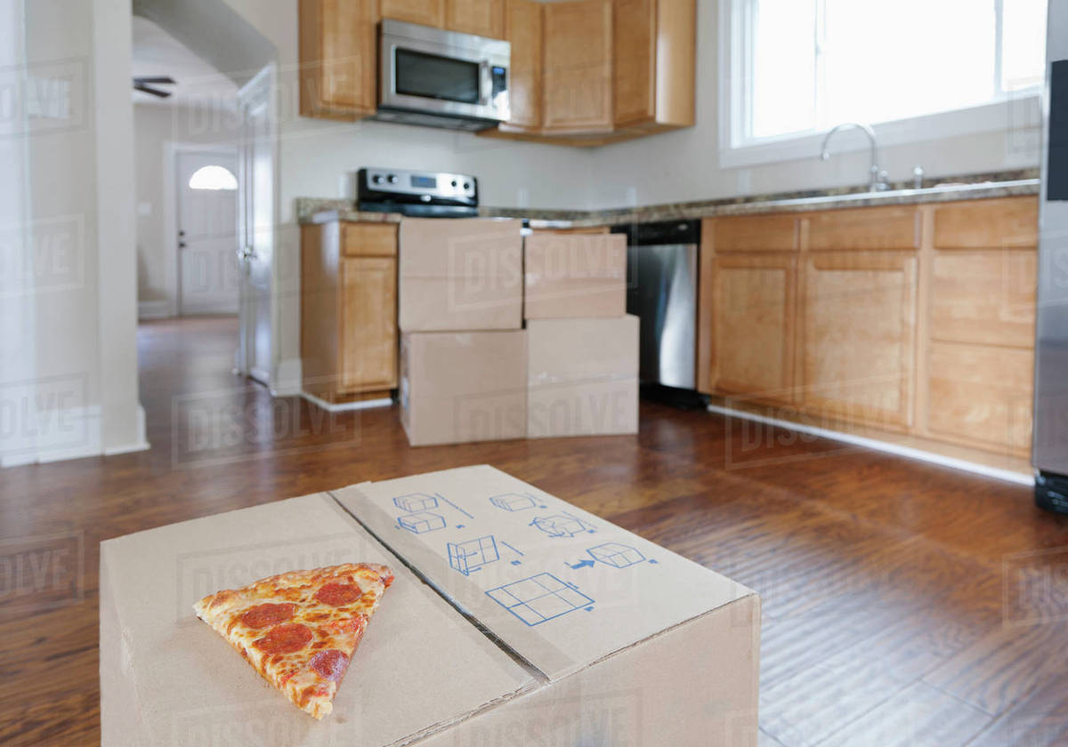 Boxes and cartons stacked in a house - Royalty-free Stock Photo | Dissolve