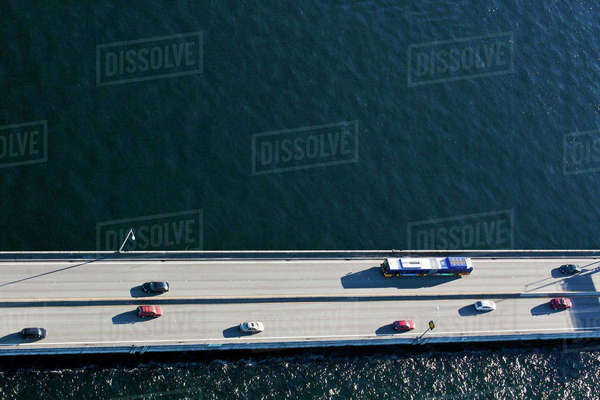 View of cars driving over floating bridge - Stock Photo - Dissolve