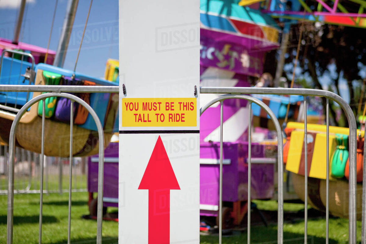 Height Requirement Sign In Front Of Amusement Park Ride - Royalty-free ...