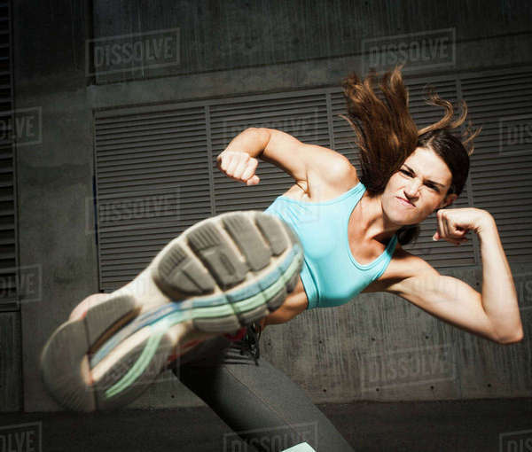 Caucasian woman kicking - Royalty-free Stock Photo | Dissolve