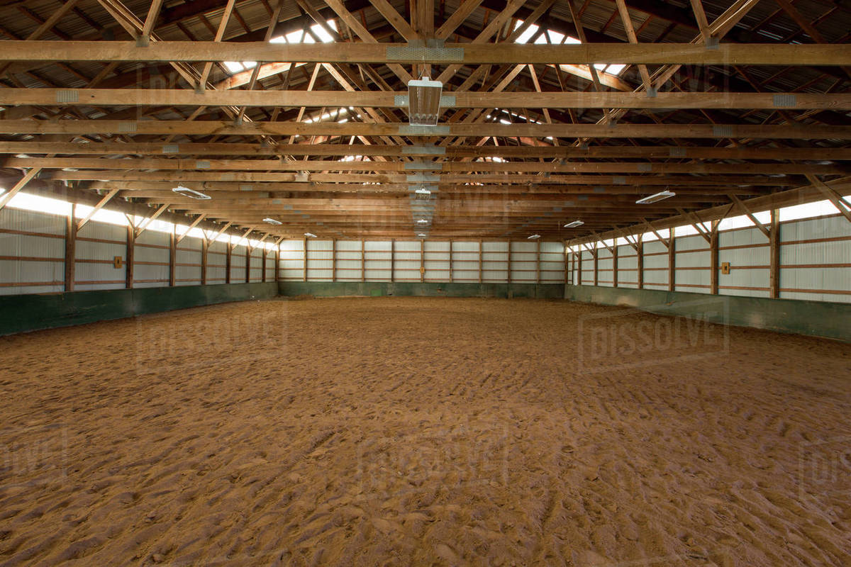 Empty indoor horse riding ring - Royalty-free Stock Photo | Dissolve