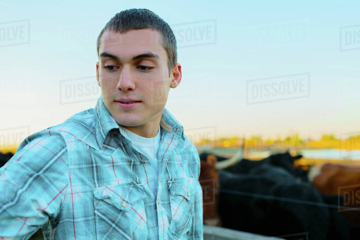 Caucasian man working on farm - Royalty-free Stock Photo | Dissolve