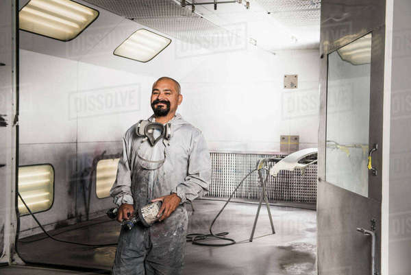 Hispanic mechanic working in auto shop - Royalty-free Stock Photo ...