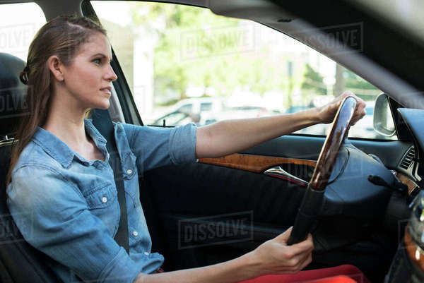 Caucasian woman driving car - Stock Photo - Dissolve