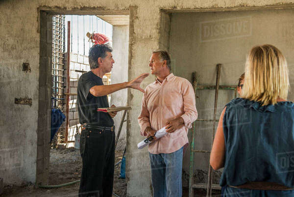 Architects talking at construction site - Royalty-free Stock Photo ...